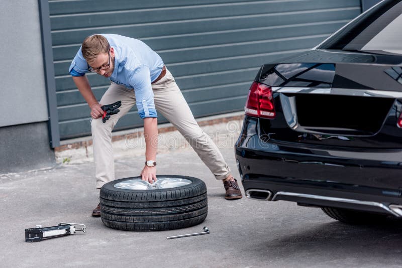 Young Handsome Man Changing Car Stock Image - Image of corporate, drive ...