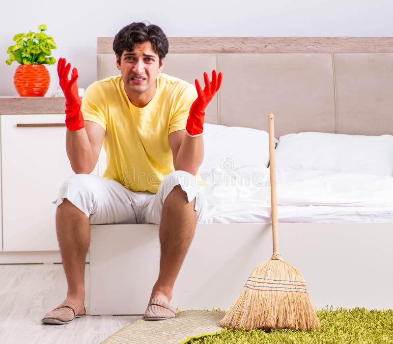 Young Handsome Man Cleaning in the Bedroom Stock Photo - Image of ...
