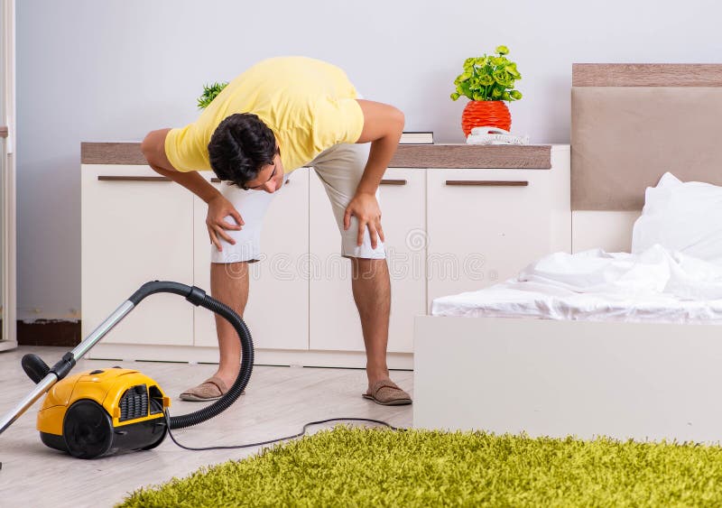 Young Handsome Man Cleaning in the Bedroom Stock Photo - Image of ...