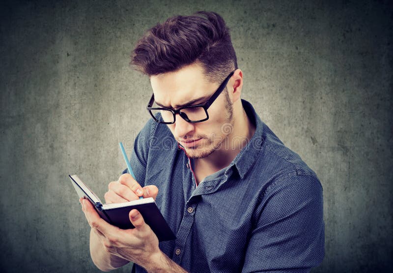 Serious Man Taking Notes with Concentration Stock Photo - Image of ...