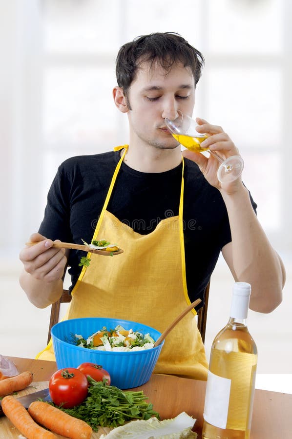 Young Handsome Man Cooking Salad on Kitchen Stock Image - Image of ...