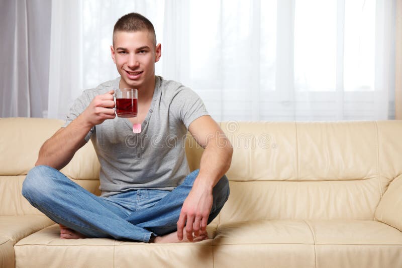 Young Handsome Man with a Cup of Tea at Home Stock Image - Image of ...