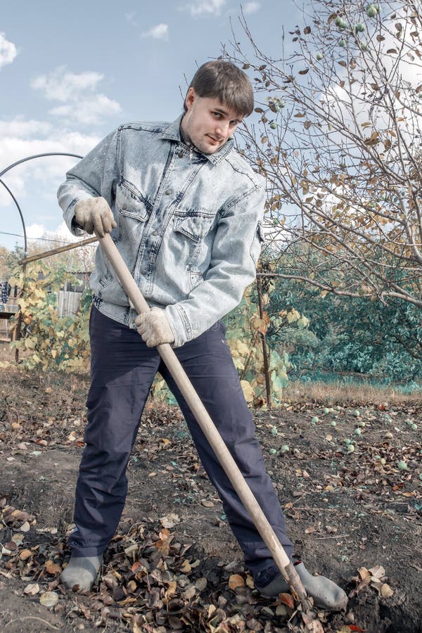 Young Handsome Man Digs the Ground Under the Landing Stock Photo ...
