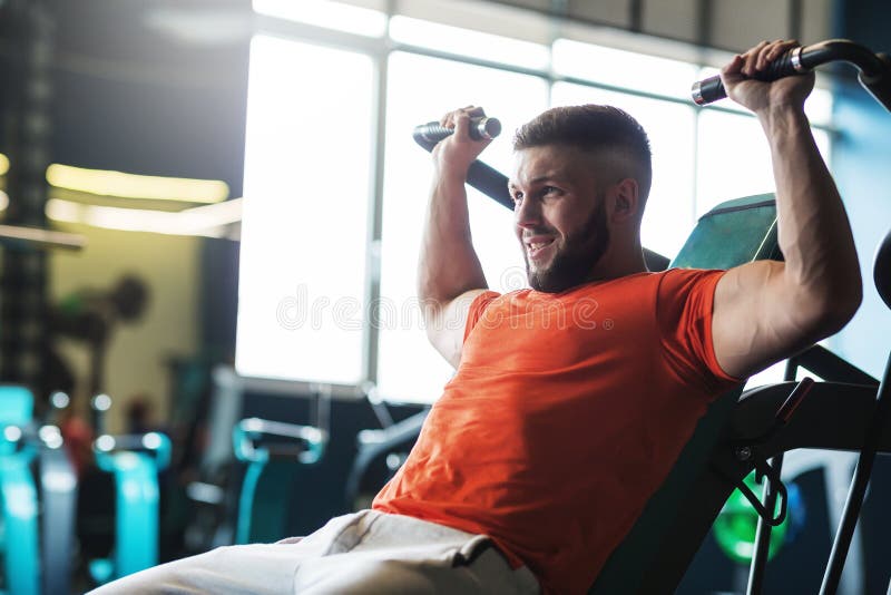 Young Handsome Man Doing Exercises in Gym Stock Photo - Image of ...