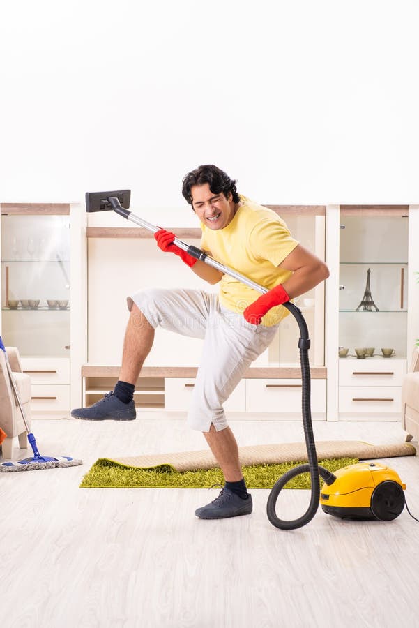 The Young Handsome Man Doing Housework Stock Photo - Image of dust ...