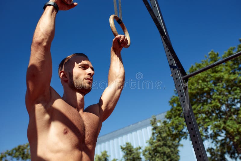 Young Handsome Man Doing Some Push Ups Using Loops Stock Photos - Free ...