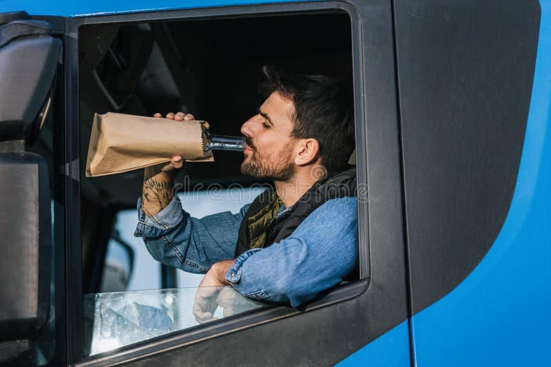 Handsome Man Driving Long Vehicle, Taking a Break from Long Ride and ...