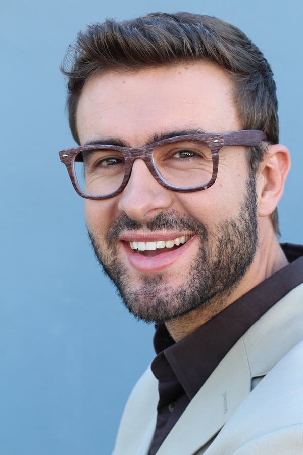 Young Handsome Man with Great Smile Wearing Fashion Eyeglasses Against ... Young Handsome Man with Great Smile Wearing Fashion Eyeglasses Against ...
