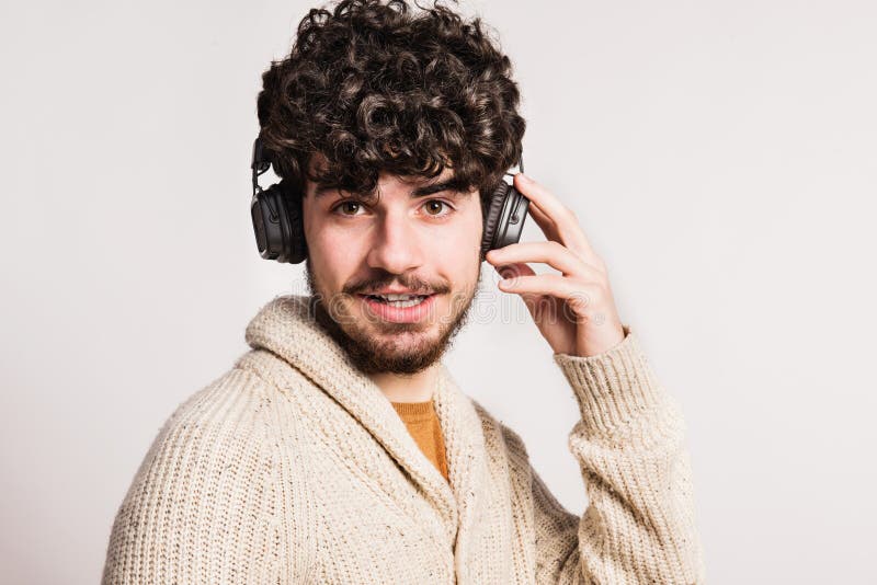 Portrait of a Young Man with Headphones in a Studio. Stock Image ...