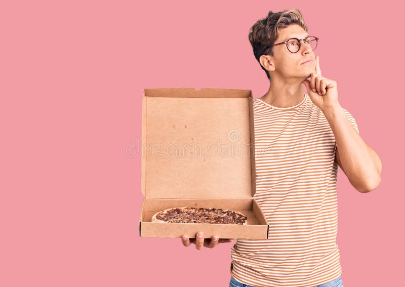 Young Handsome Man Holding Delivery Pizza Box Serious Face Thinking ...