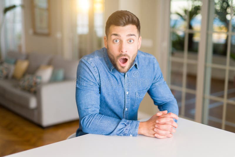 Young Handsome Man at Home Scared in Shock with a Surprise Face, Afraid ...
