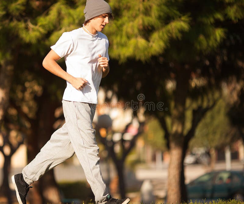 Young Handsome Man Jogging in Public Park Stock Image - Image of jogger ...