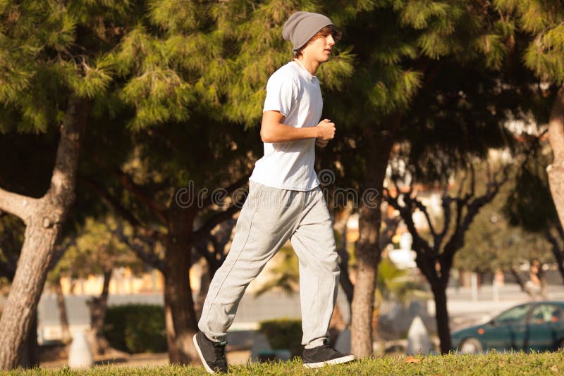 Young Handsome Man Jogging in Public Park Stock Photo - Image of ...