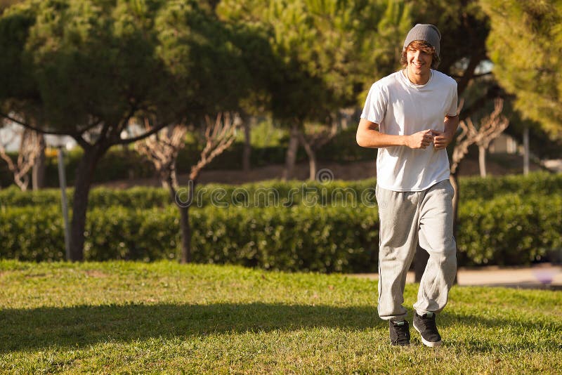 Young Handsome Man Jogging in Public Park Stock Photo - Image of sport ...