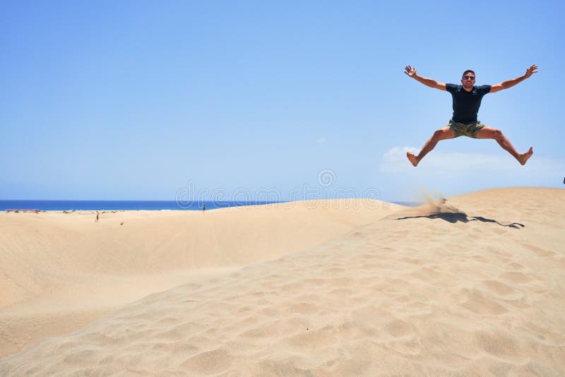 Young Handsome Man Jumping at the Beach Stock Image - Image of laugh ...