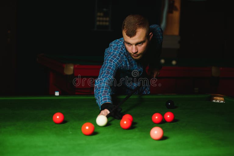 Young Handsome Man Leaning Over the Table while Playing Snooker Stock ...