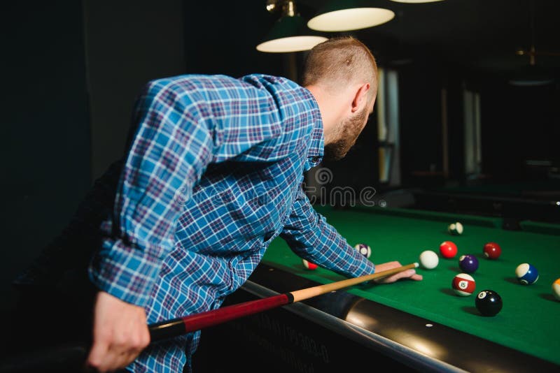 Young Handsome Man Leaning Over the Table while Playing Snooker Stock ...