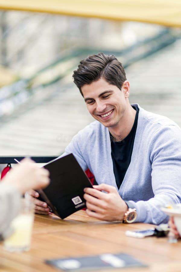 Young Handsome Man Looking at the Menu Stock Photo - Image of cafe ...