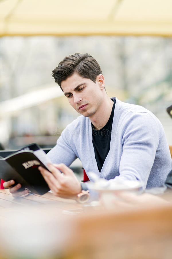 Young Handsome Man Looking at the Menu Stock Photo - Image of hungry ...
