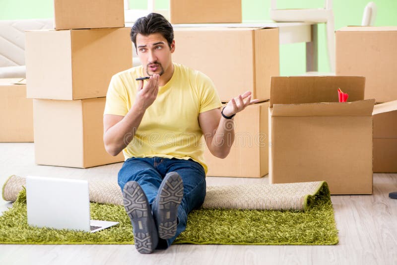 The Young Handsome Man Moving in To New House with Boxes Stock Image ...