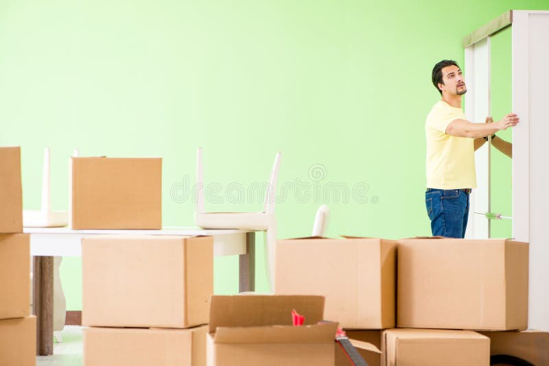 The Young Handsome Man Moving in To New House with Boxes Stock Image ...