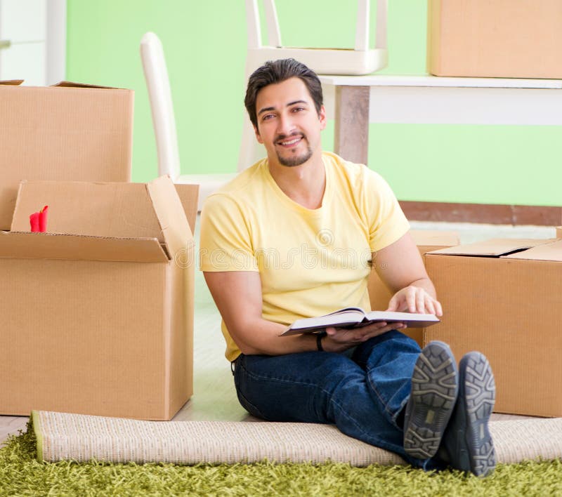 Young Handsome Man Moving in To New House with Boxes Stock Image ...