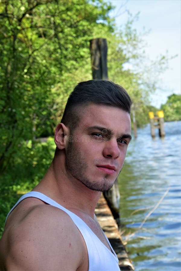 Young Handsome Man Over Water Stock Image - Image of silence, lifestyle ...