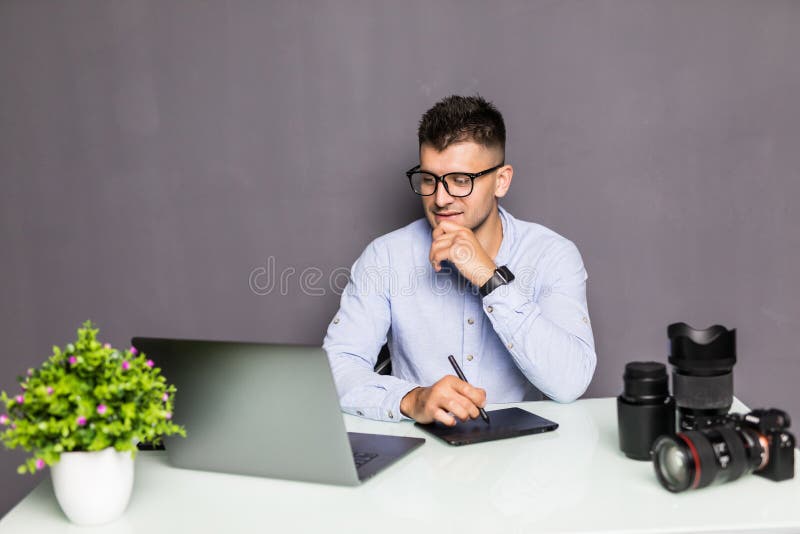 Young Handsome Man Photo Editor Using Graphics Tablet in Office Stock ...