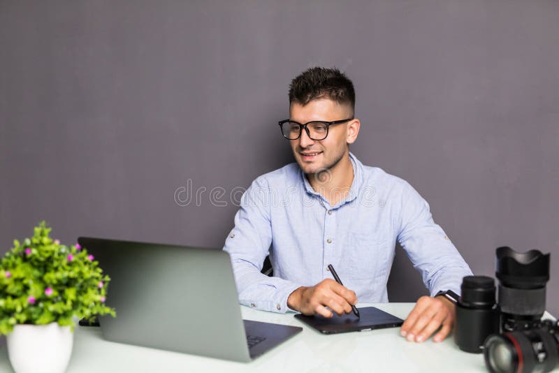Young Handsome Man Photo Editor Using Graphics Tablet in Office Stock ...