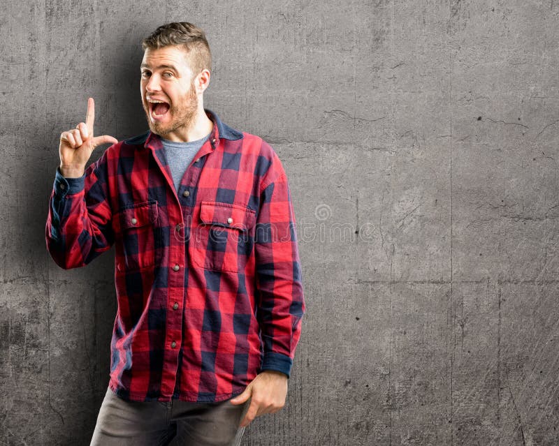 Young Handsome Man Over Wall Background Stock Image - Image of pointed ...