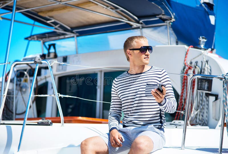 Young and Handsome Man on a Sailing Boat Stock Photo - Image of ...
