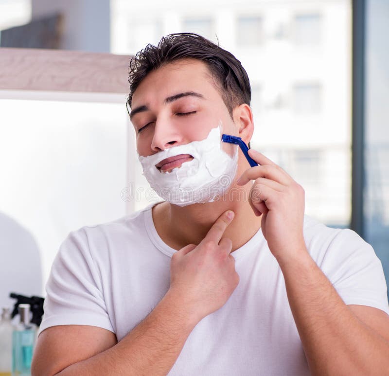 Young Handsome Man Shaving in the Morning Stock Photo - Image of face ...
