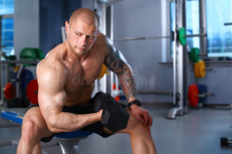 Young Handsome Man Sits after Workout in the Gym Stock Photo - Image of ...