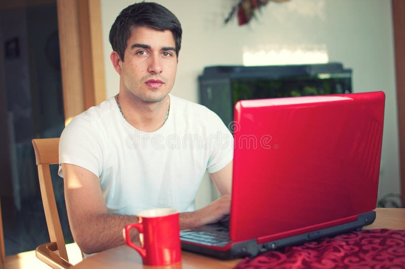 Young Handsome Man Sitting with Coffee and Laptop Stock Image - Image ...