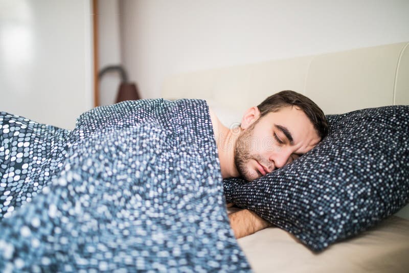 Young Handsome Man Sleeping Comfortably in Bed at Home Stock Photo ...