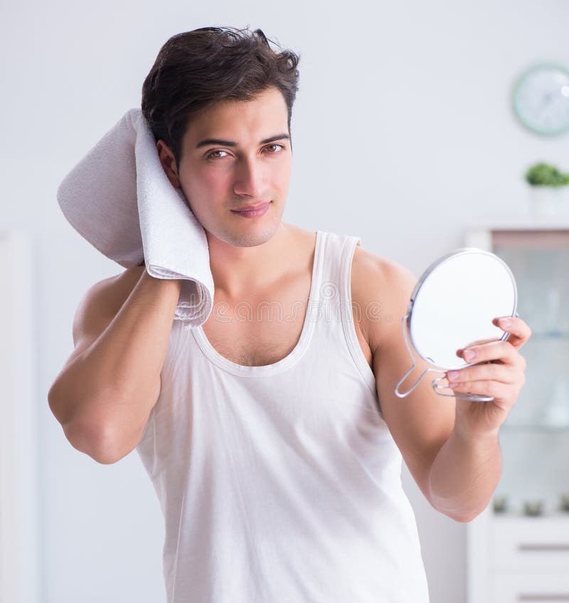 Young Handsome Man Staring in the Mirror Stock Image - Image of ...