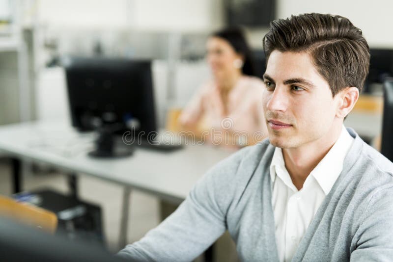 Young Handsome Man Studying Information Technology in a Classroo Stock ...
