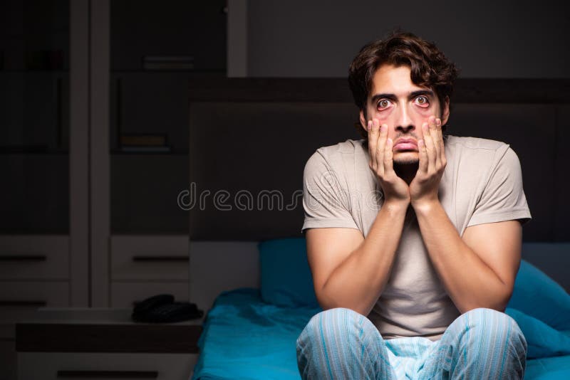 The Young Handsome Man Suffering from Insomnia in Bed Stock Photo ...