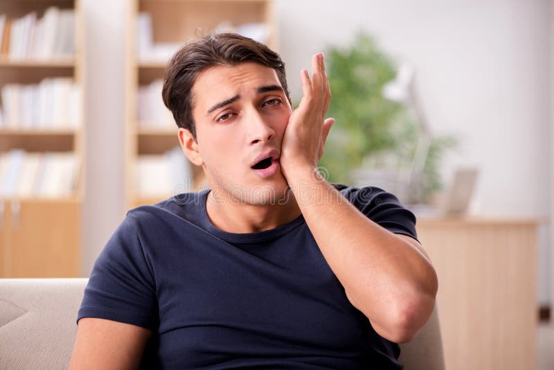 The Young Handsome Man Suffering from Pain Stock Photo - Image of ...