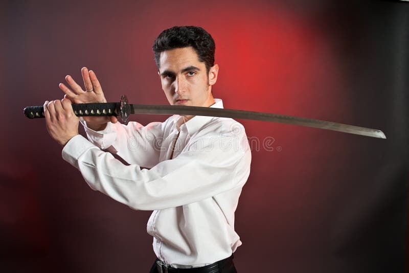 Young Handsome Man with Sword. Stock Photo - Image of trendy, stubble ...