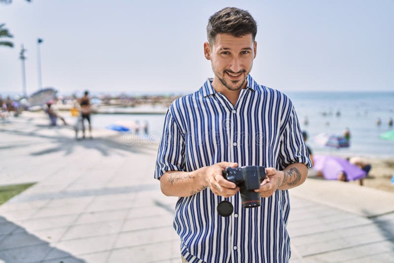 Young Handsome Man Using Dslr Photography Camera by the Sea Stock Image ...