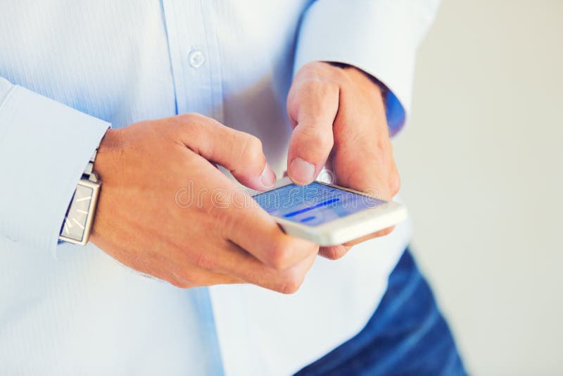 Young man using cell phone stock image. Image of outside - 42018549