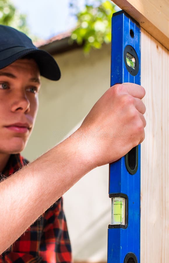 Young Handsome Man Using Spirit Level in His Work Stock Image - Image ...