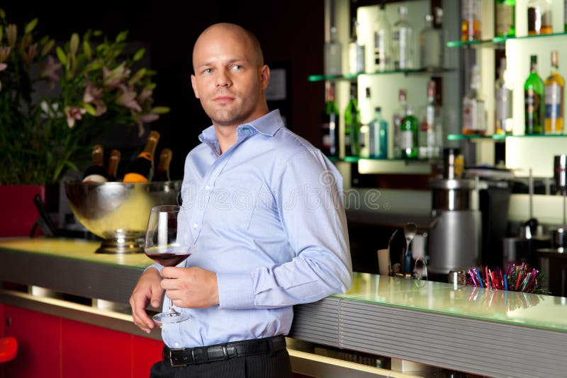 Young Handsome Man Waiting Next To the Bar Stock Photo - Image of drink ...