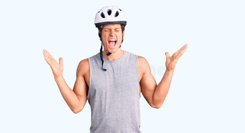 Young Handsome Man Wearing Bike Helmet Celebrating Mad And Crazy For