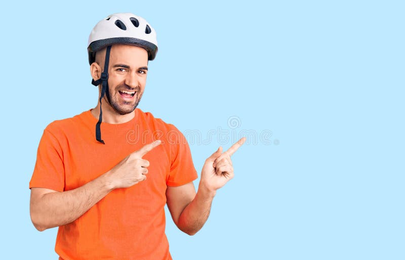 Young Handsome Man Wearing Bike Helmet Smiling And Looking At The