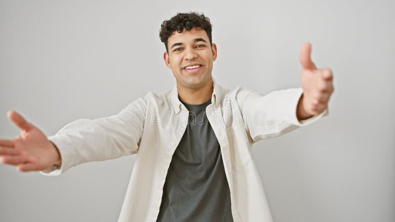 A Young, Handsome Man with a Welcoming Smile Extends His Arms Against a ...