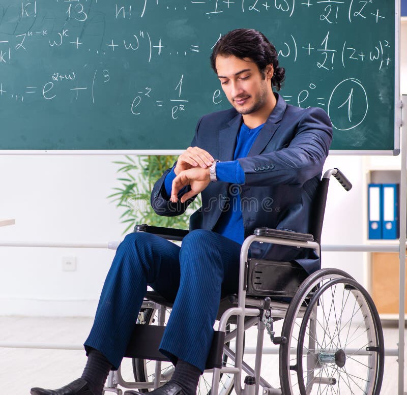 Young Handsome Man in Wheelchair in Front of Chalkboard Stock Photo ...
