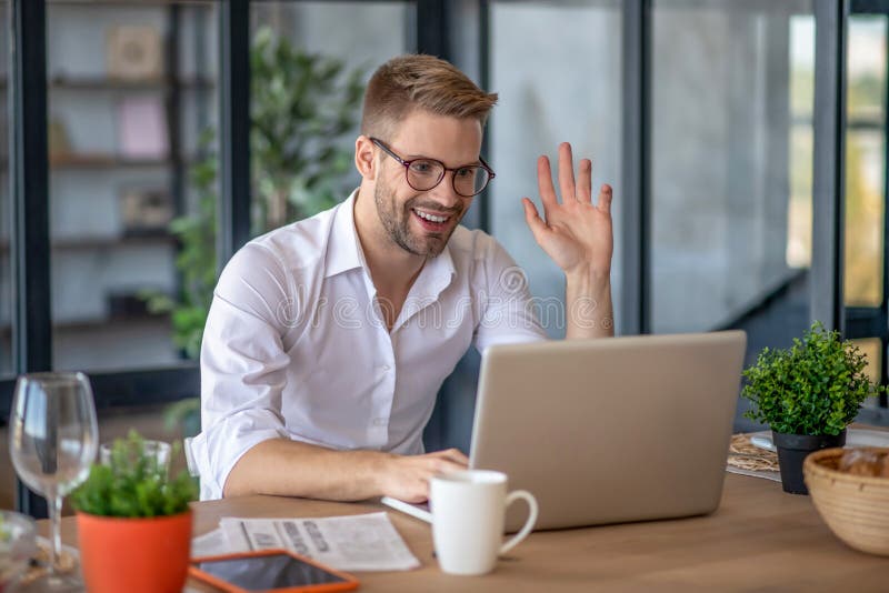 Young Handsome Man in White Shirt Having a Video Call Stock Photo ...
