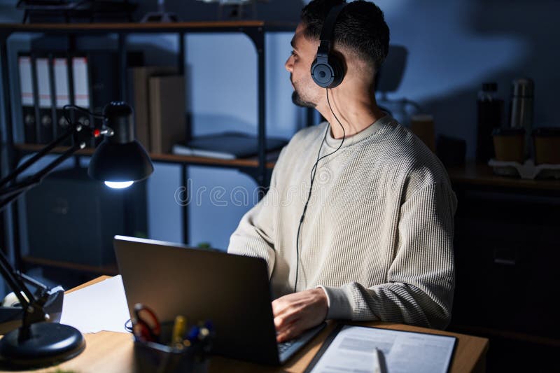 Young Handsome Man Working Using Computer Laptop at Night Looking To ...